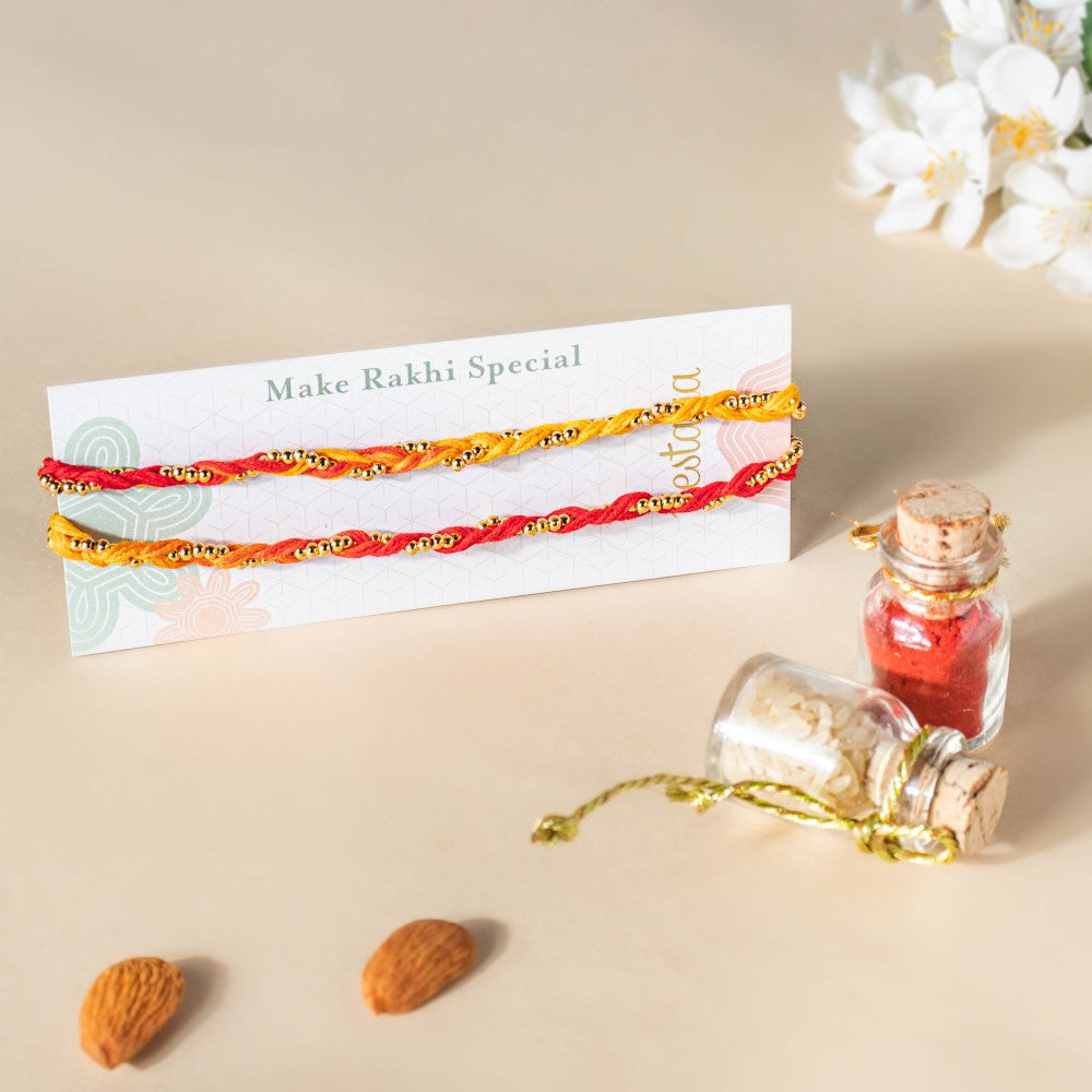 Beaded Thread Rakhi Set Of 2 With Rice Roli